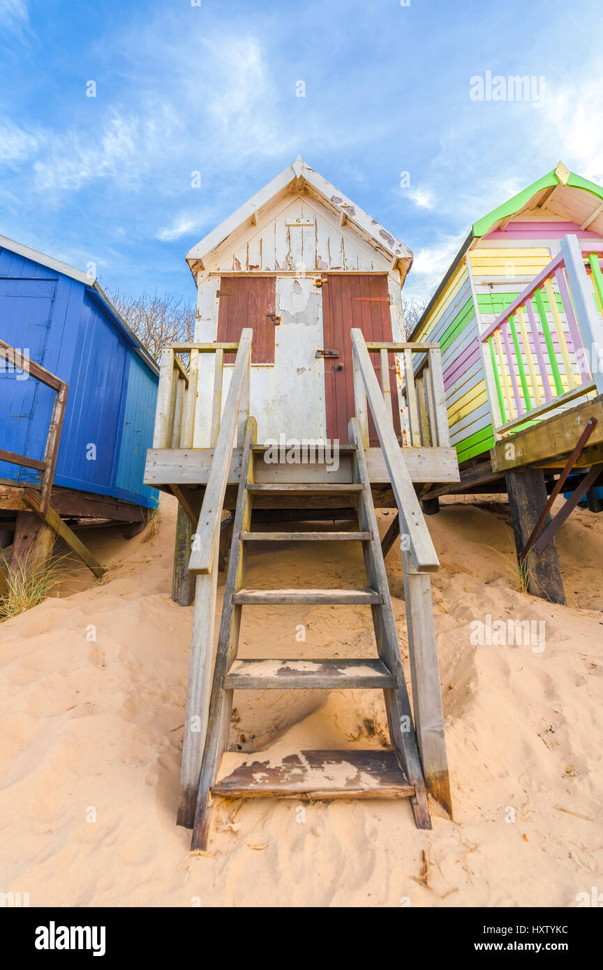 weathered beach hut on golden sand Stock Photo - Alamy