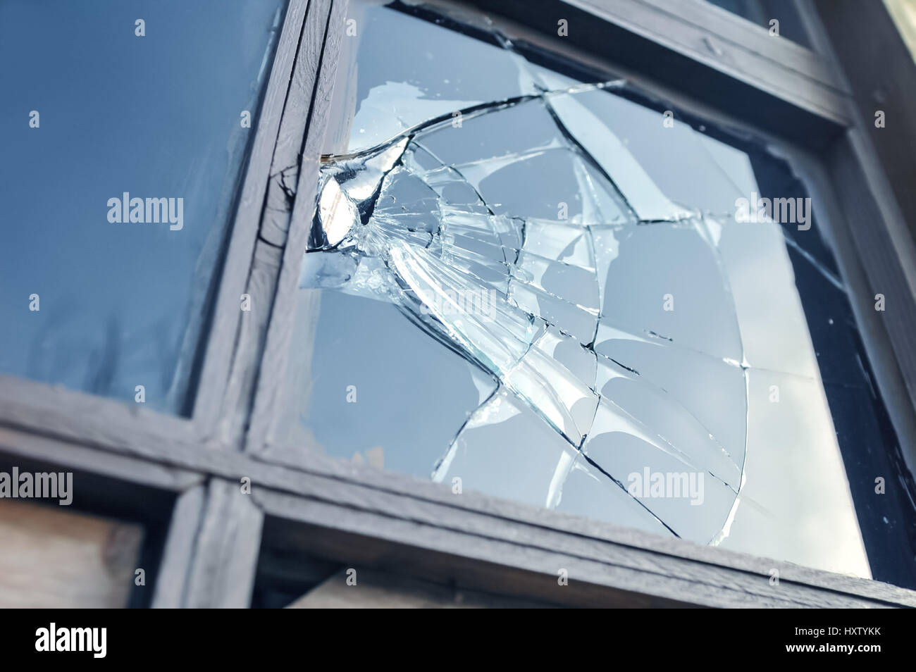 broken glass window reflecting blue sky Stock Photo - Alamy