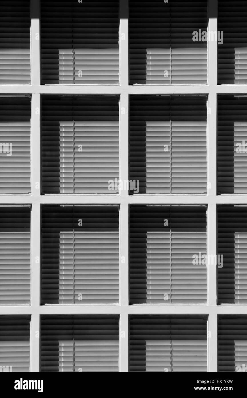 vhigh contrast enetian blinds behind white wooden window frames Stock ...