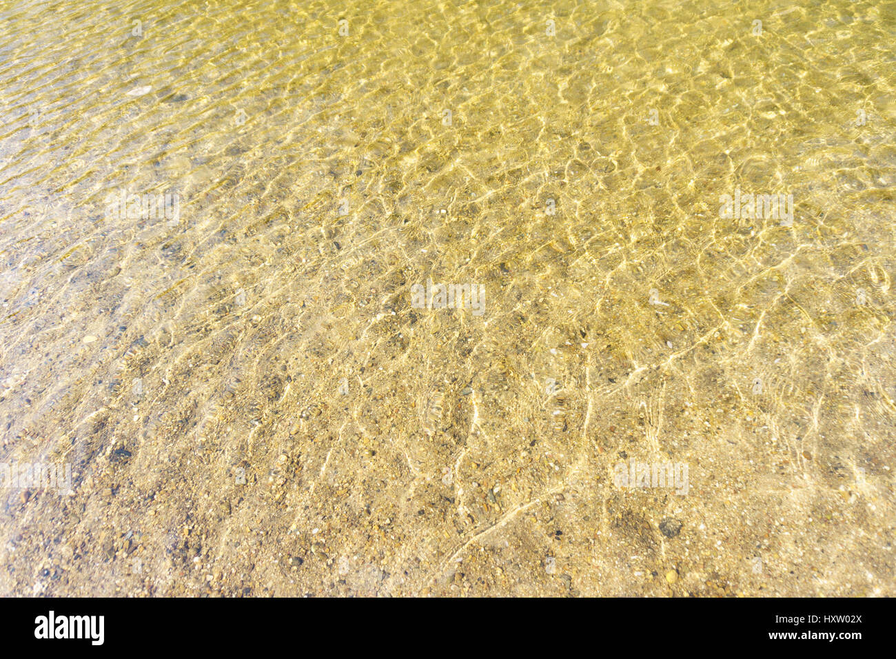 Nature sunlight with water on sand background Stock Photo - Alamy