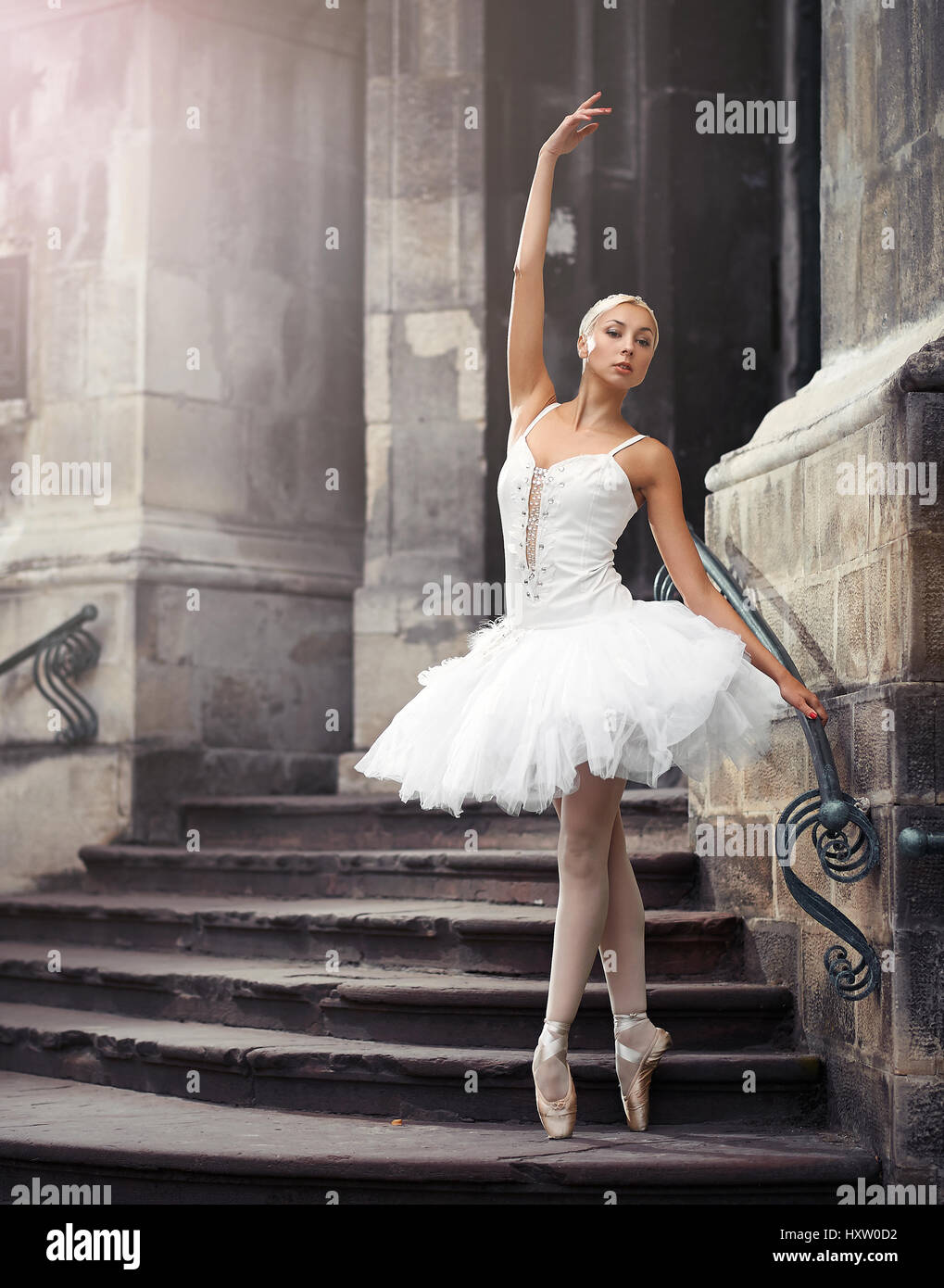 Beautiful ballet woman on stairs Stock Photo - Alamy