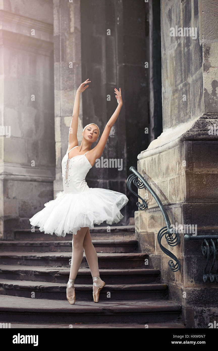 Beautiful ballet woman on stairs Stock Photo - Alamy