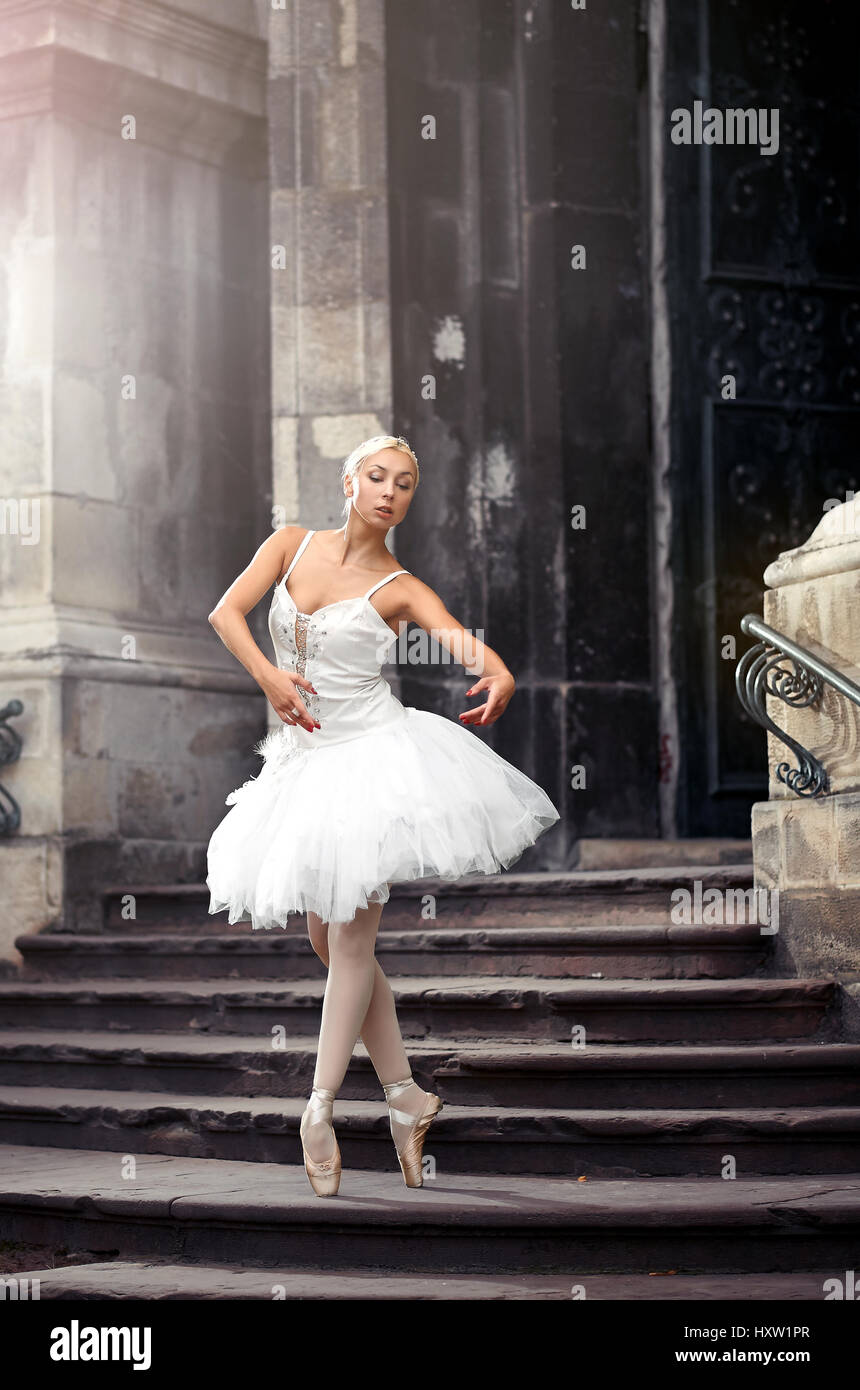 Beautiful ballet woman on stairs Stock Photo - Alamy