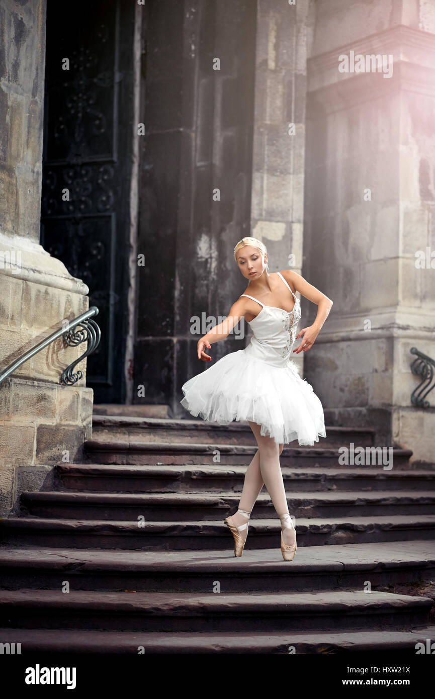 Beautiful ballet woman on stairs Stock Photo - Alamy