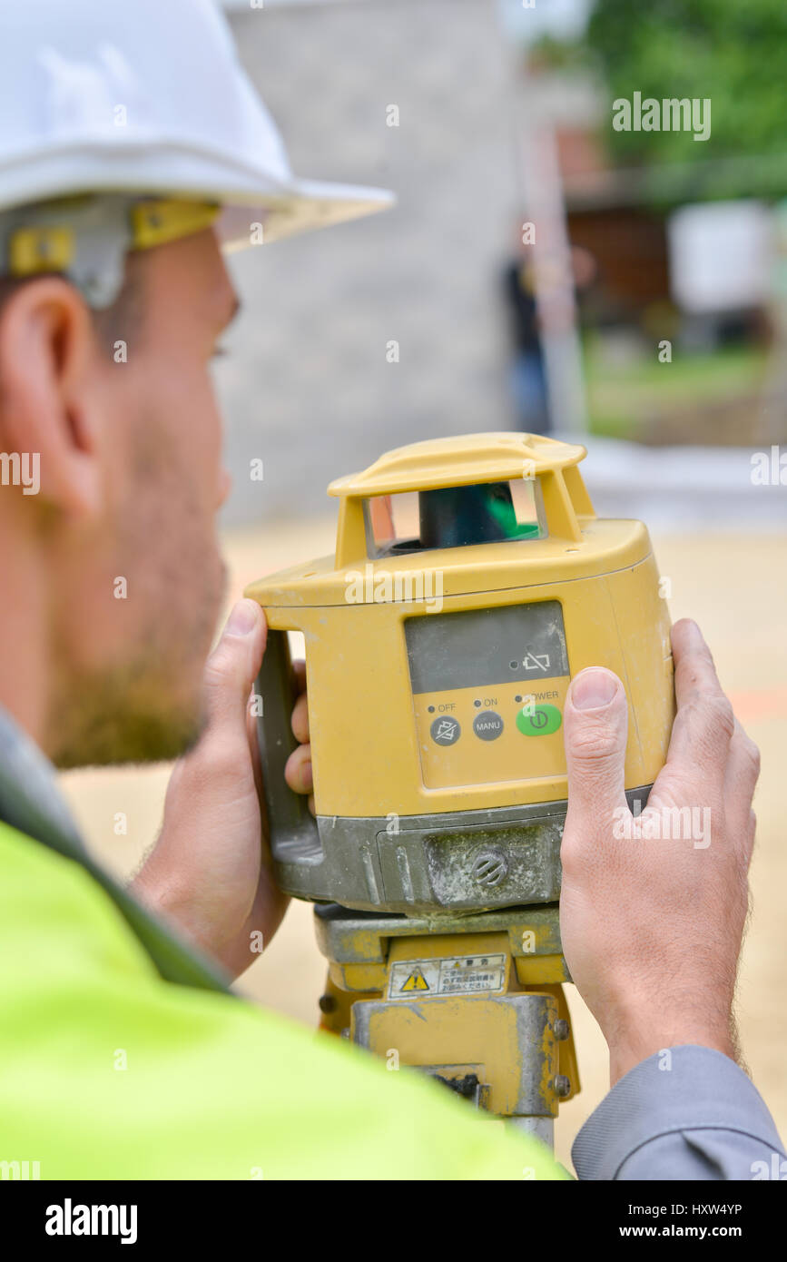 Surveyor taking a measurement Stock Photo - Alamy