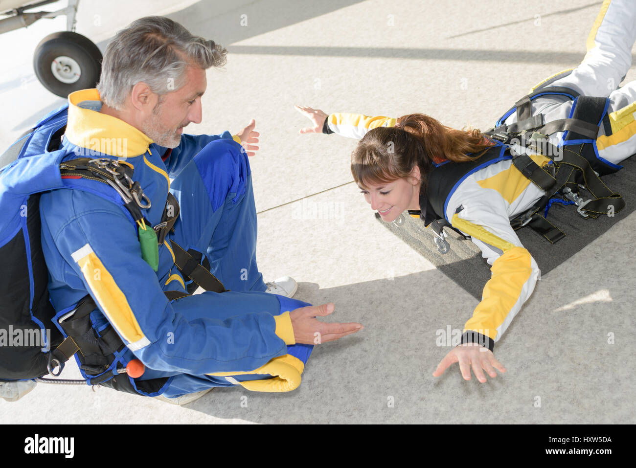 Lady practicing position for parachute jump Stock Photo - Alamy