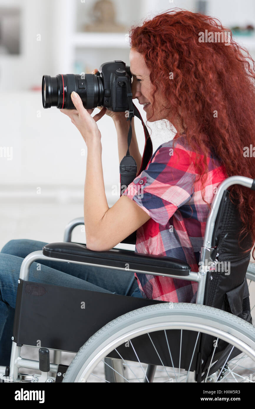 disabled woman in wheelchair have a passion for photography Stock Photo ...