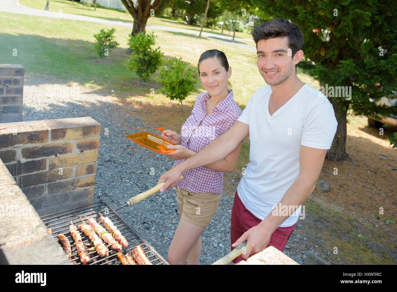 doing summer barbecue Stock Photo - Alamy