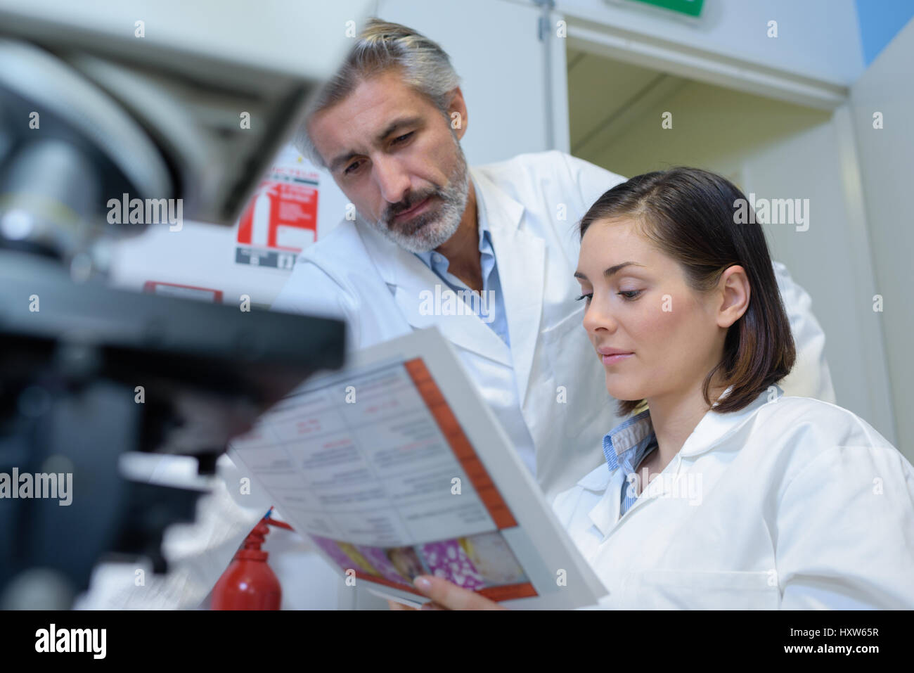 reading the latest health breakthrough Stock Photo - Alamy