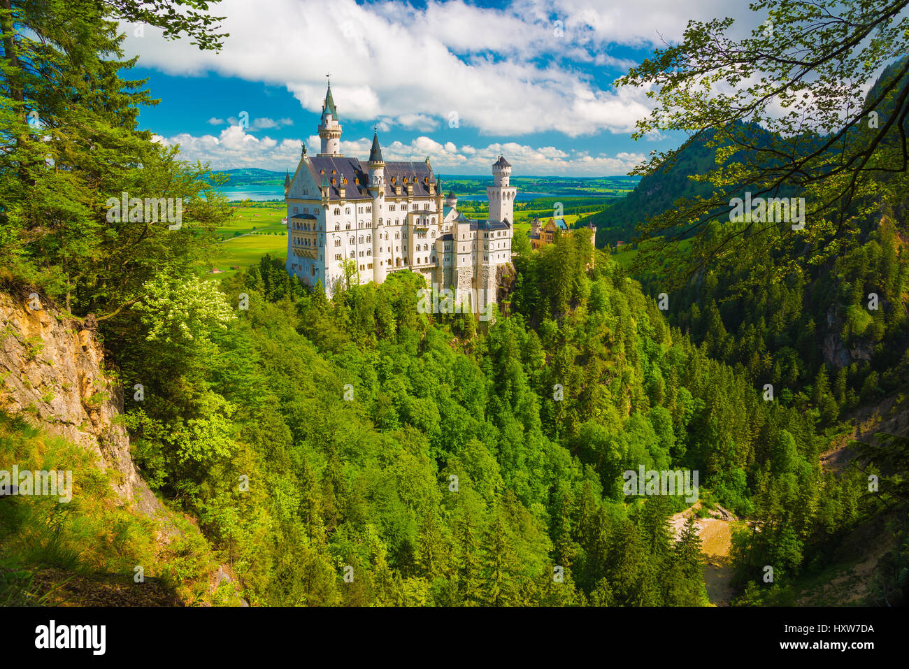 Famous fairy tale Castle in Bavaria, Neuschwanstein, Germany, panoramic view with blue sky and ...