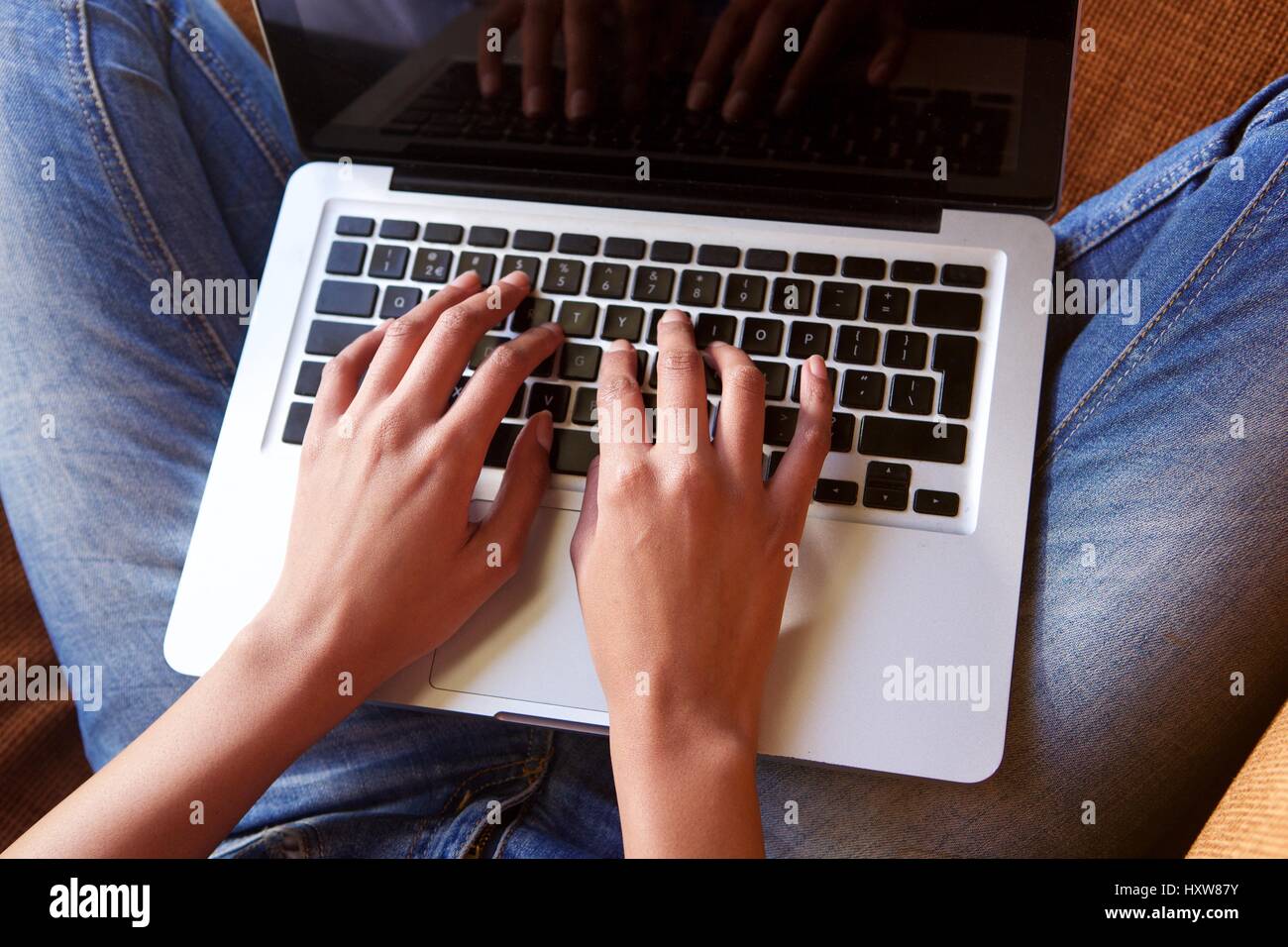 Young female hands working on laptop from above Stock Photo - Alamy
