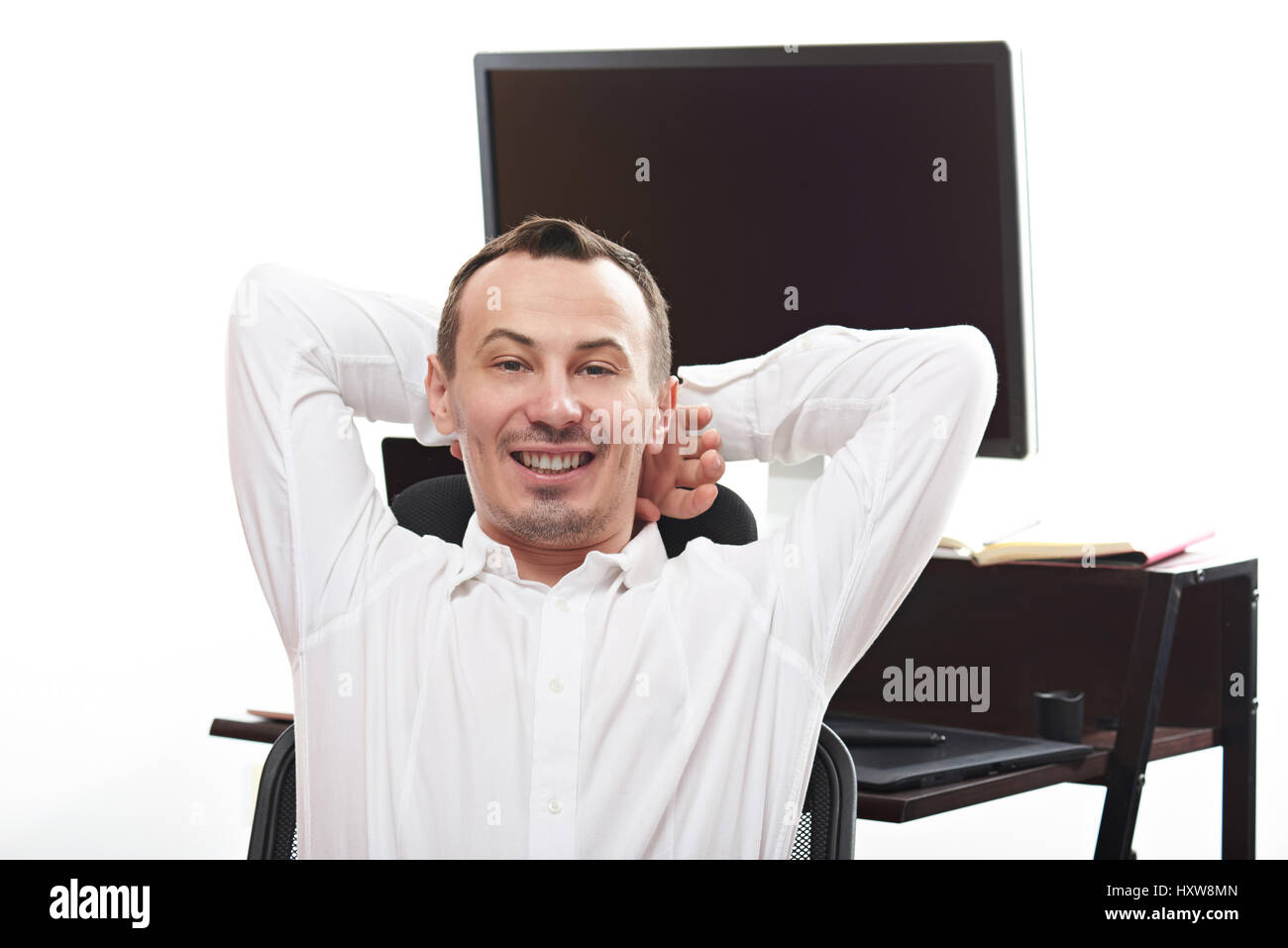 Relax man in office chair isolated on white background Stock Photo - Alamy