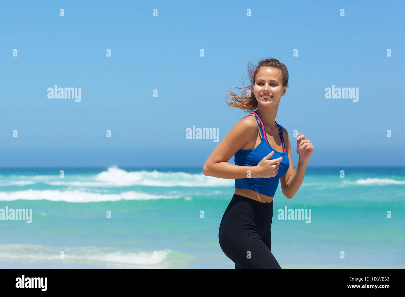 Beautiful young woman running sea hi-res stock photography and images ...