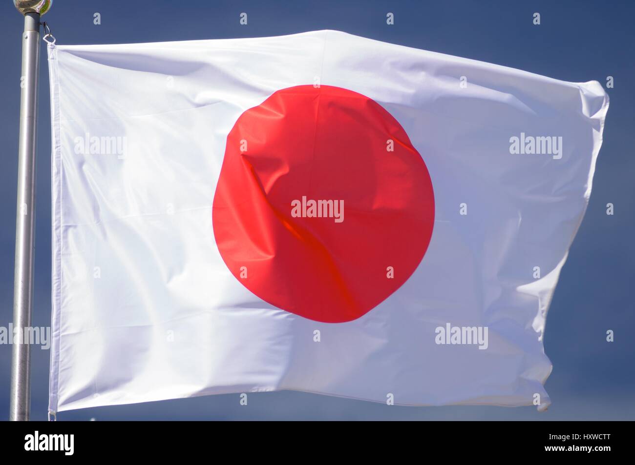 Closeup of a Japanese flag with blue sky Stock Photo - Alamy