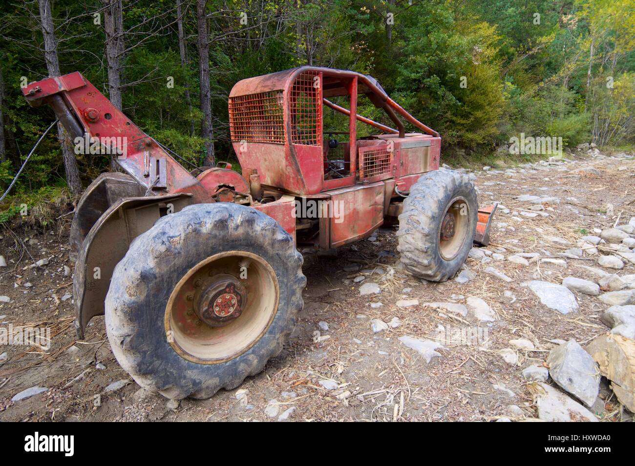 closeup of a bulldozer parked in a forest, Anso valley, Pyrenees ...