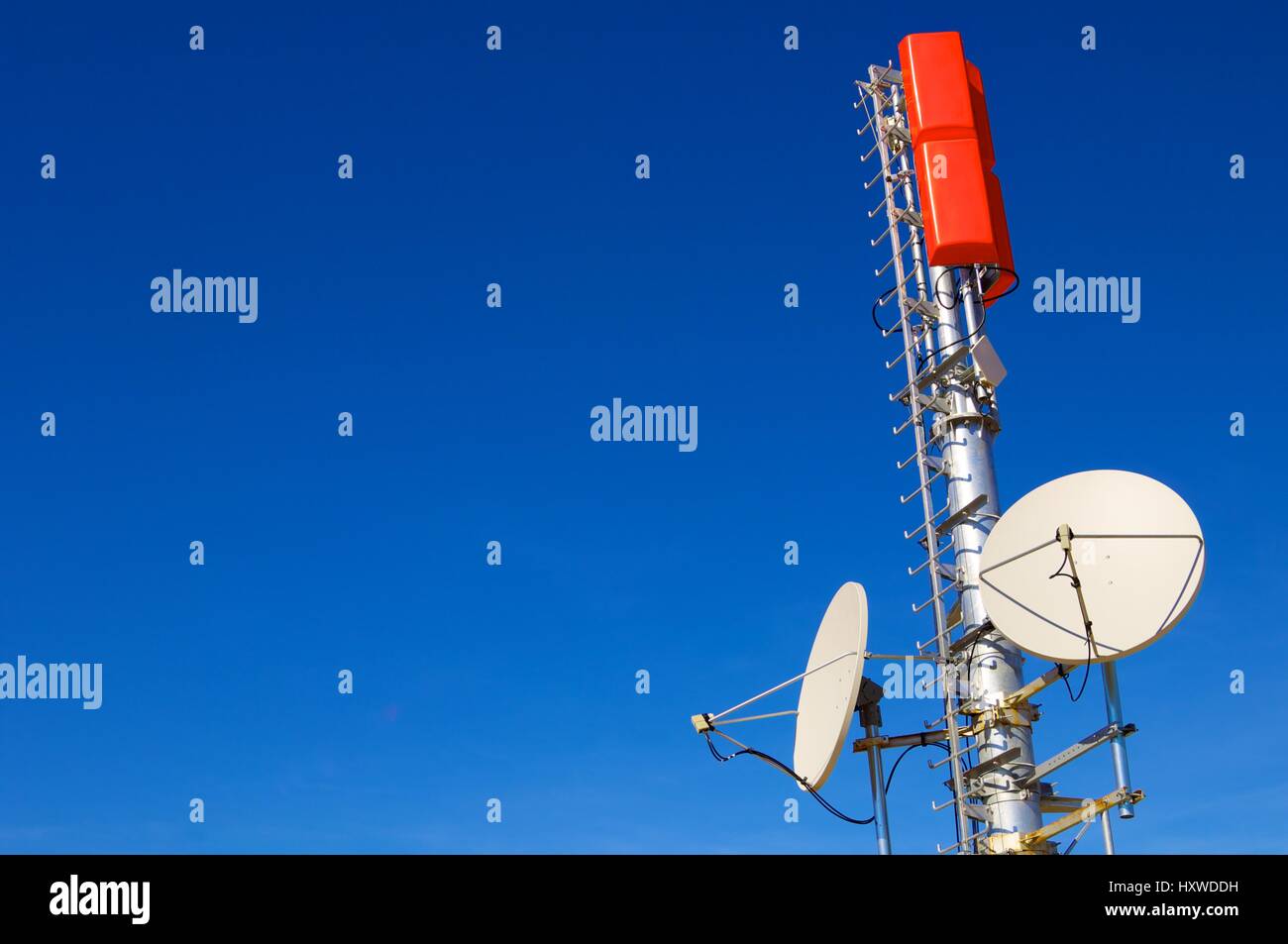 closeup of a television and radio repeater with a clear blue sky Stock ...