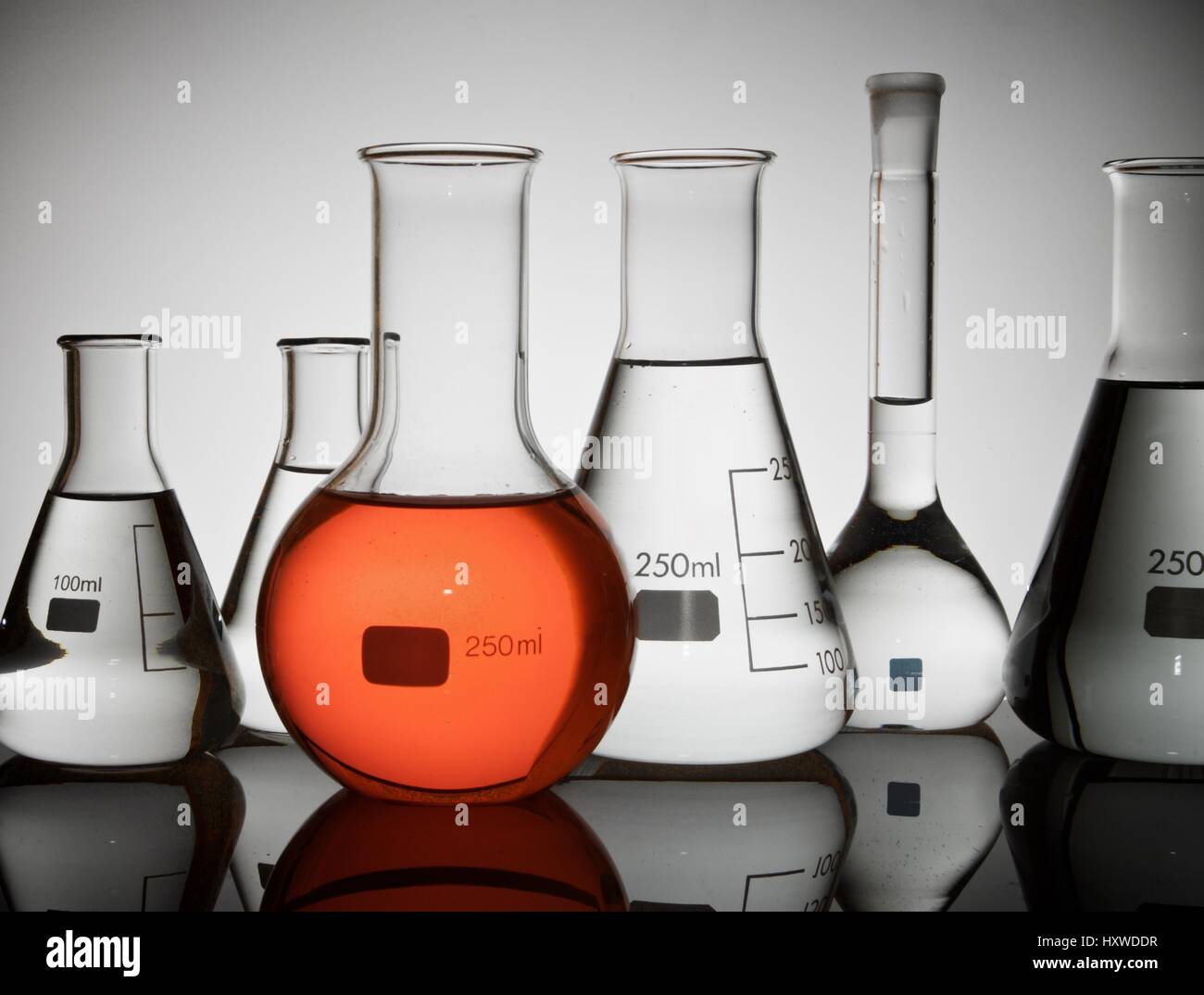 group of laboratory flasks containing liquid color Stock Photo - Alamy
