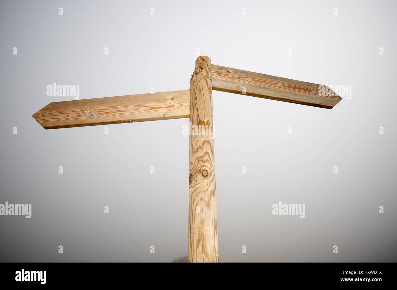 view of two wooden directional signs on a pole Stock Photo - Alamy