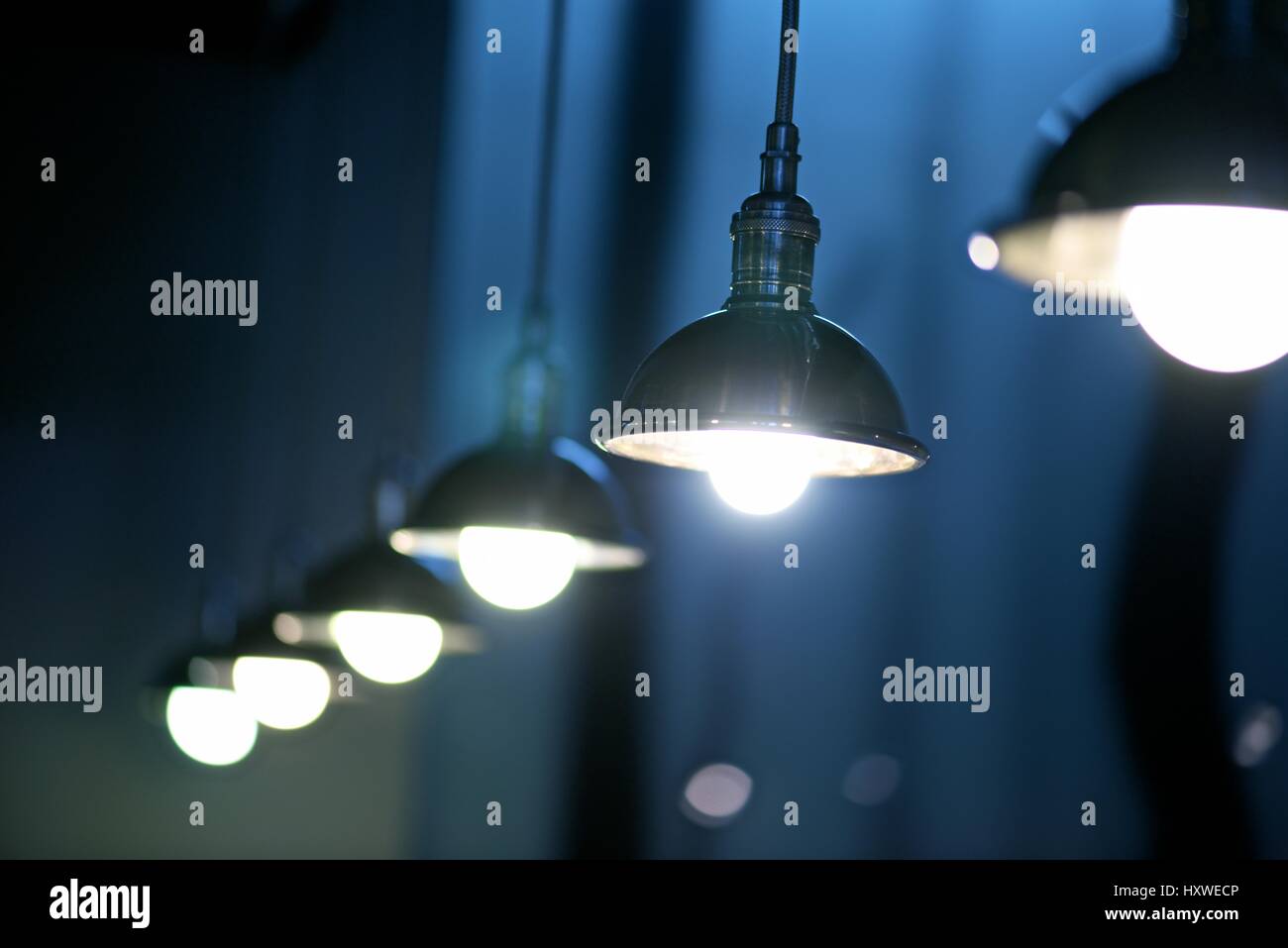 row of lamps on the inside of a bar Stock Photo - Alamy