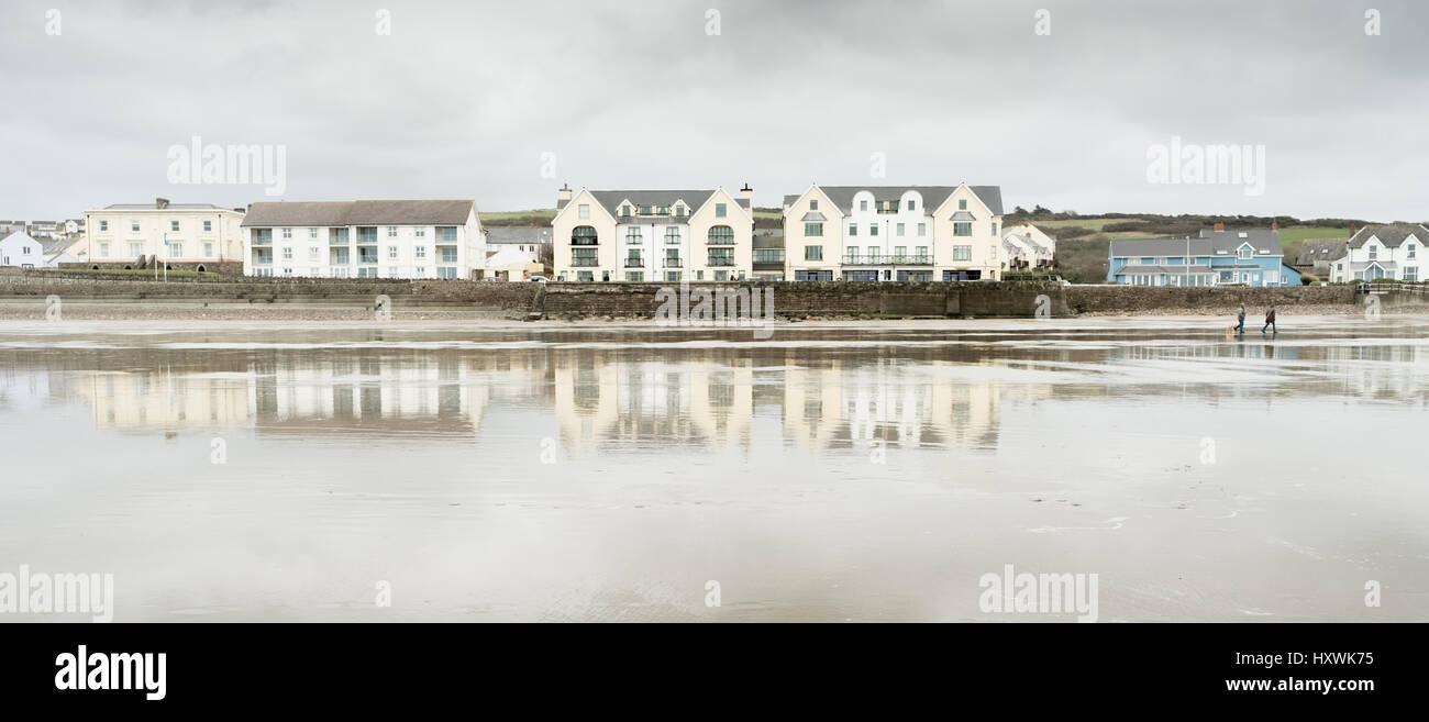 Broadhaven in winter with reflection in the sand Stock Photo - Alamy