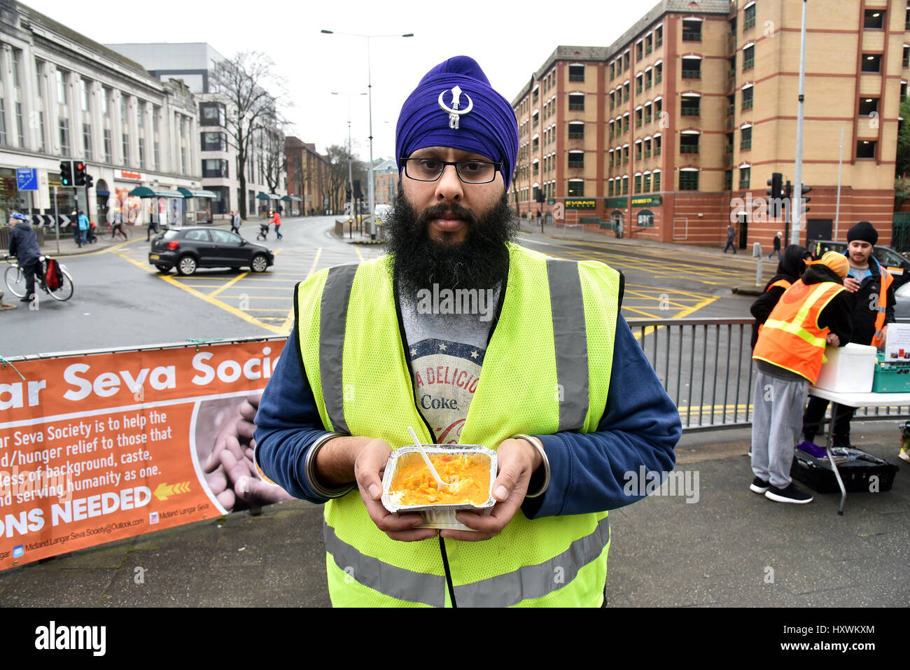 Sikh volunteers handing out curry to homeless people in Cardiff ...