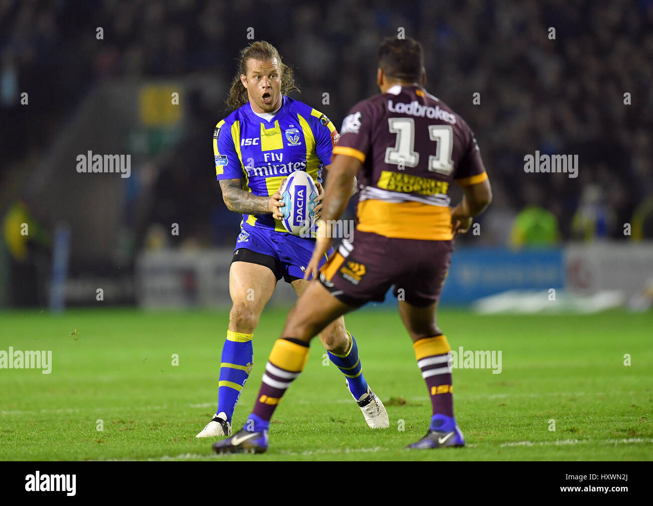 Warrington Wolves' Ashton Sims (left) and Brisbane Brocos' Sam Thaida ...