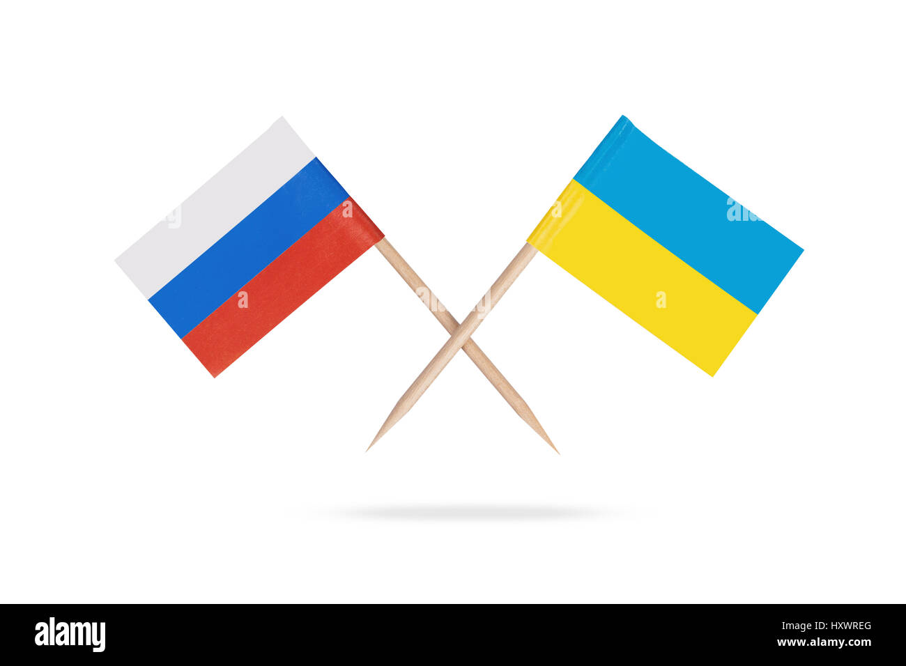 Crossed mini flags Russia and Ukraine with shadow below. Isolated on ...
