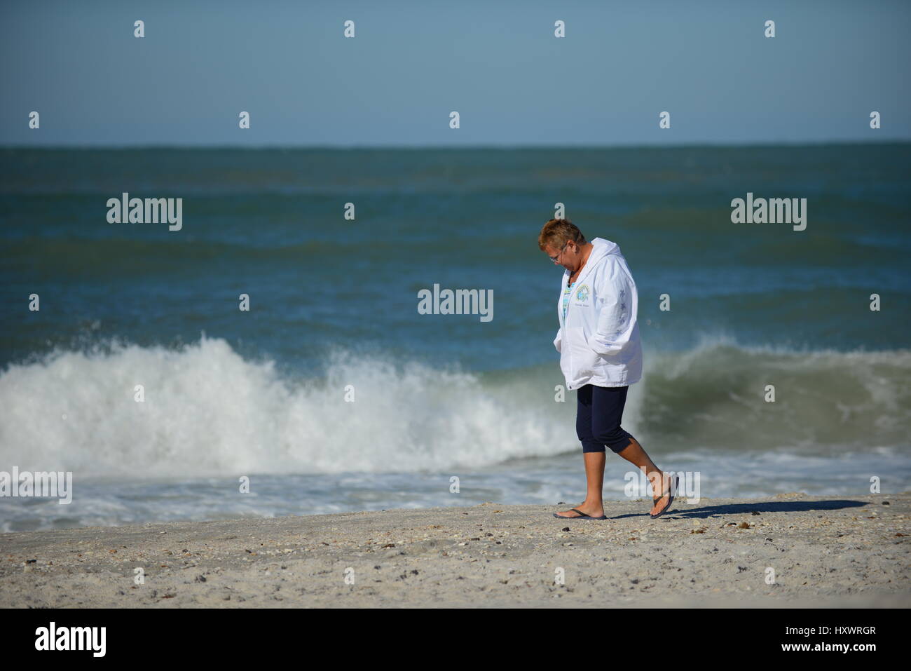 Crashing waves person hi-res stock photography and images - Alamy