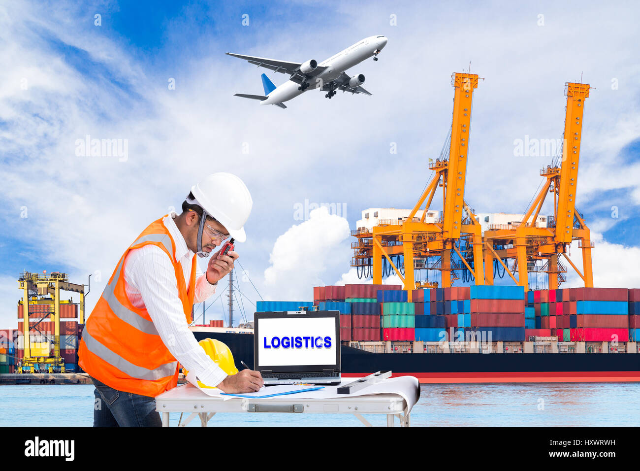 Engineer dockers talking on the walkie-talkie for controlling loading ...