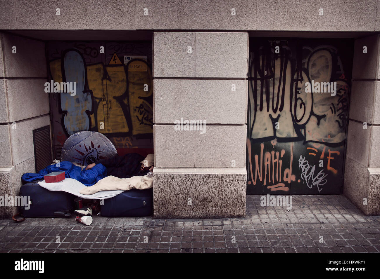 A homeless man is sleeping on street in Barcelona, Spain Stock Photo ...