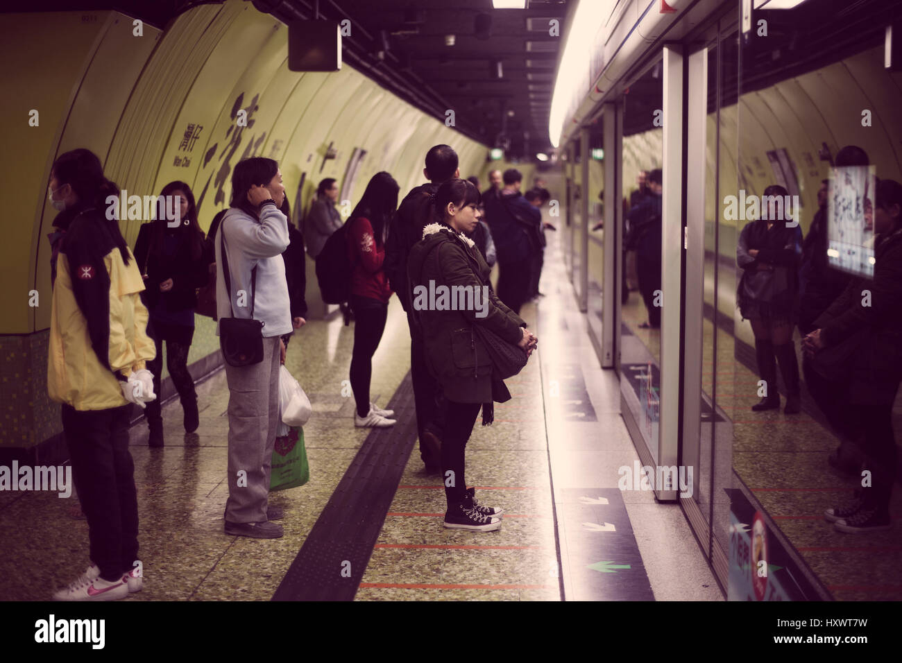 Passengers are waiting for the metro in Hong Kong. The MTR is a rapid ...