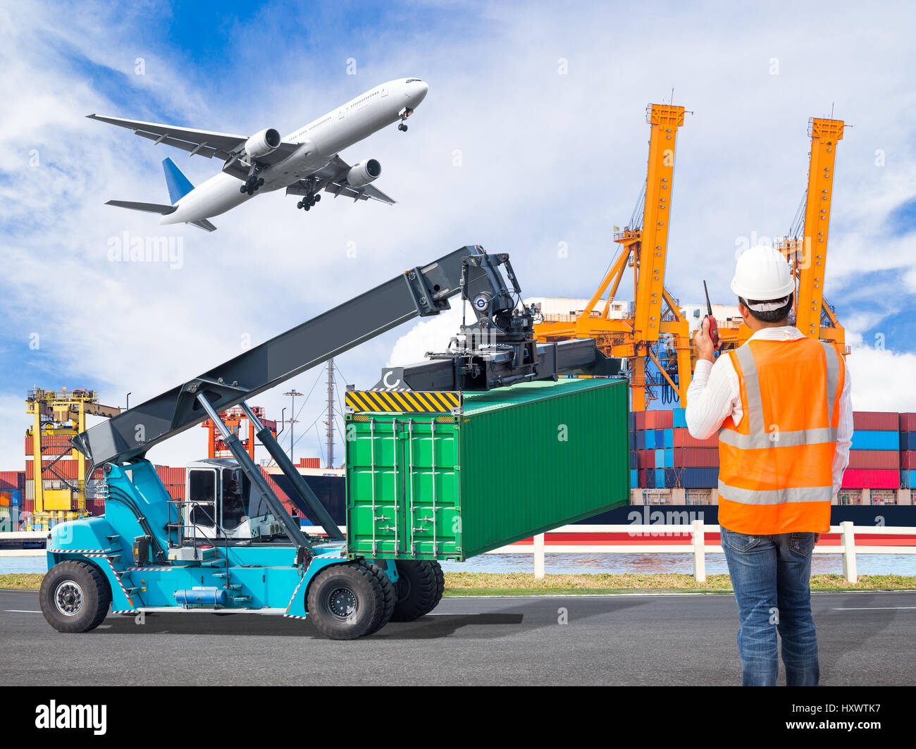 Dock worker talking with radio for controlling loading container in an ...