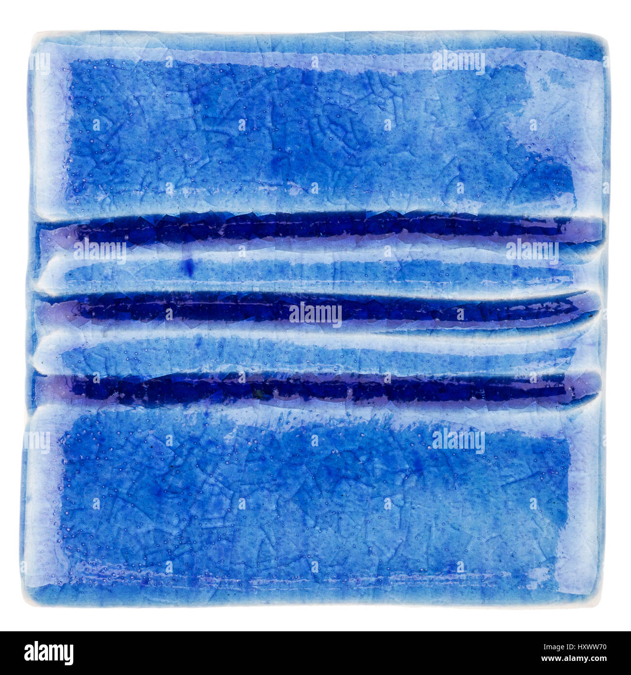 Blue lined handmade glazed ceramic tile isolated on white background ...