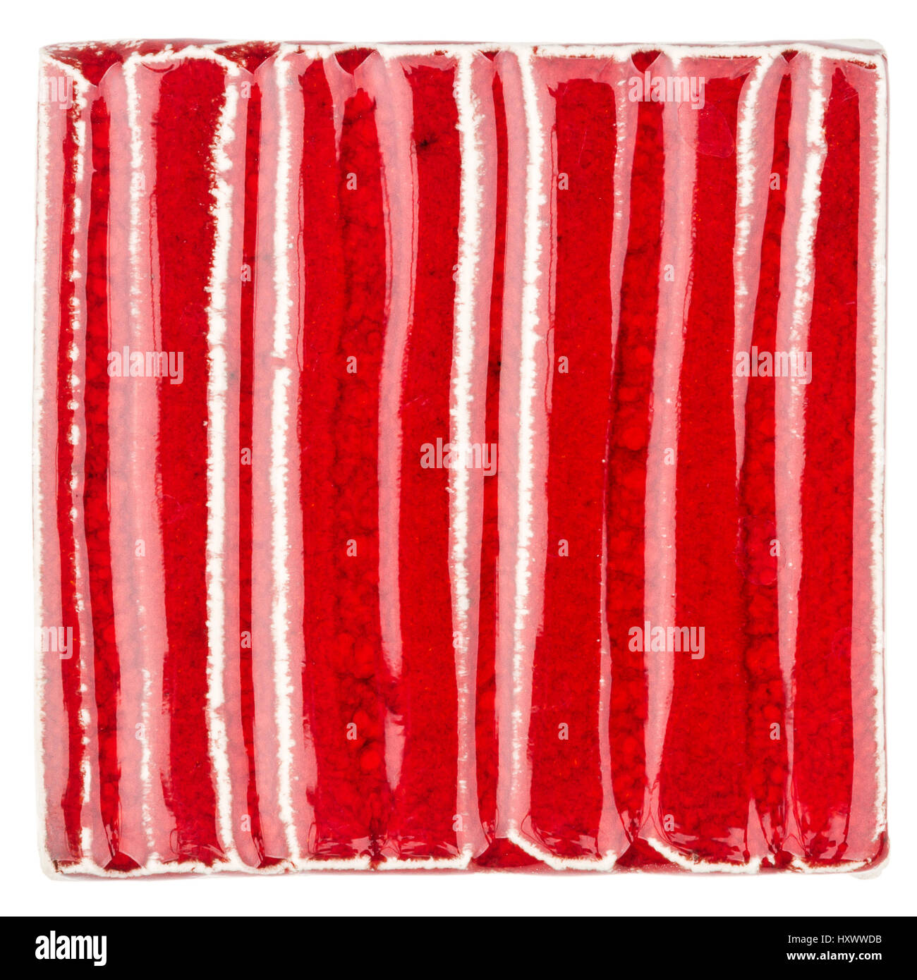 Red lined handmade glazed ceramic tile isolated on white background ...