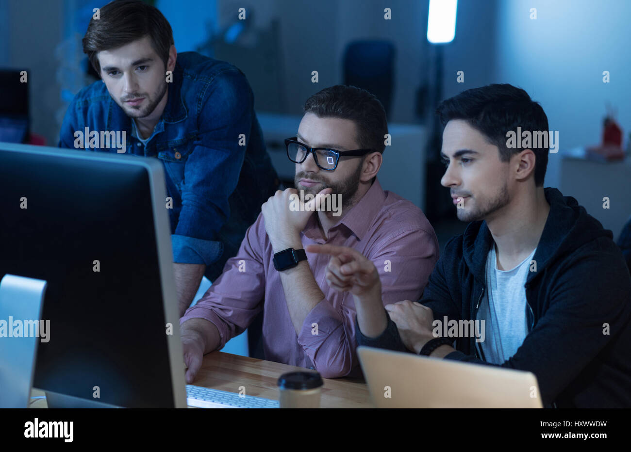 Intelligent handsome man pointing at the screen Stock Photo - Alamy