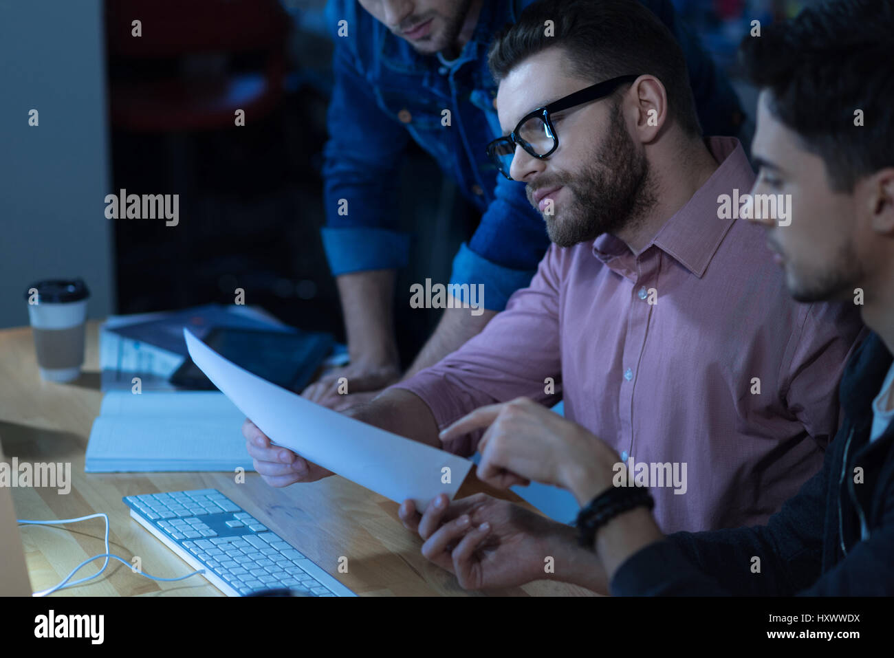 Nice male programmers working together Stock Photo - Alamy