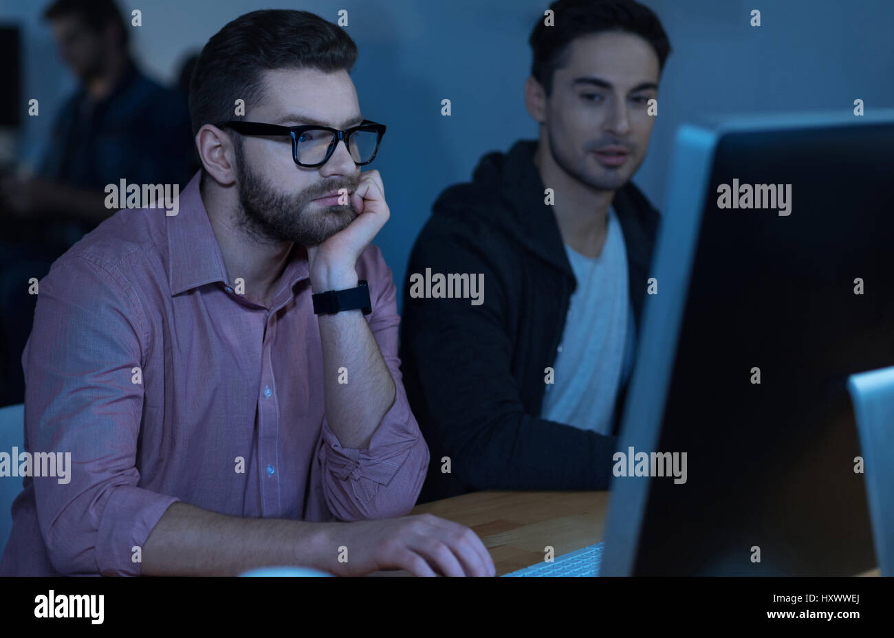 Thoughtful hard working man looking at the computer screen Stock Photo ...
