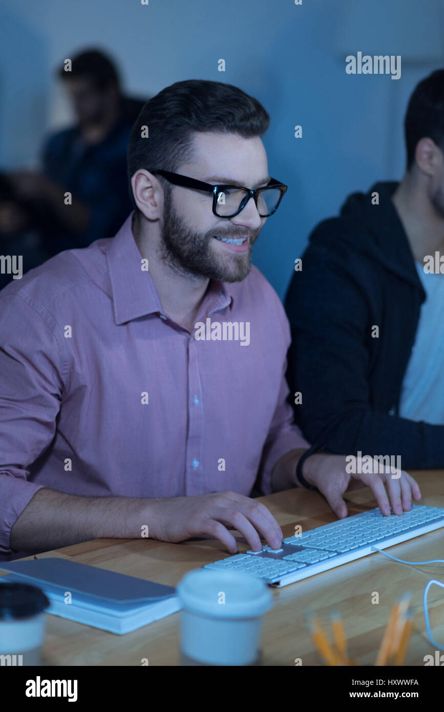 Handsome man typing on keyboard hi-res stock photography and images - Alamy