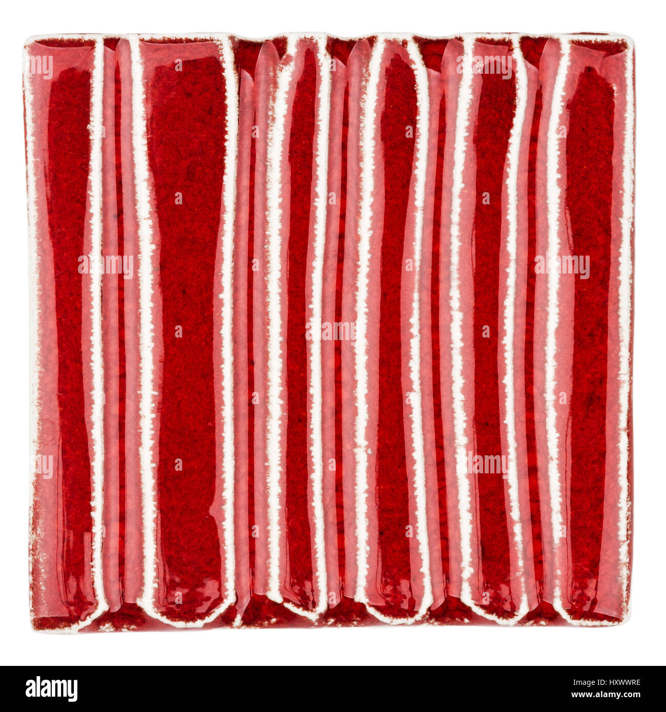 Red lined handmade glazed ceramic tile isolated on white background ...