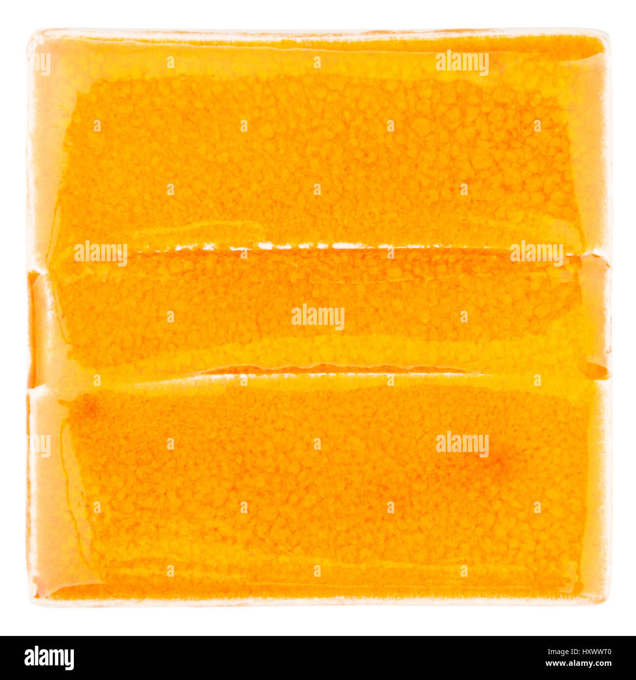 Orange lined handmade glazed ceramic tile isolated on white background ...