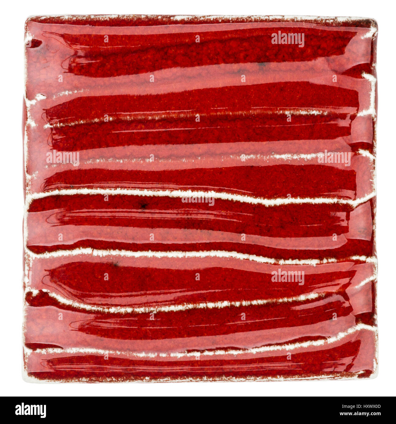 Red lined handmade glazed ceramic tile isolated on white background ...