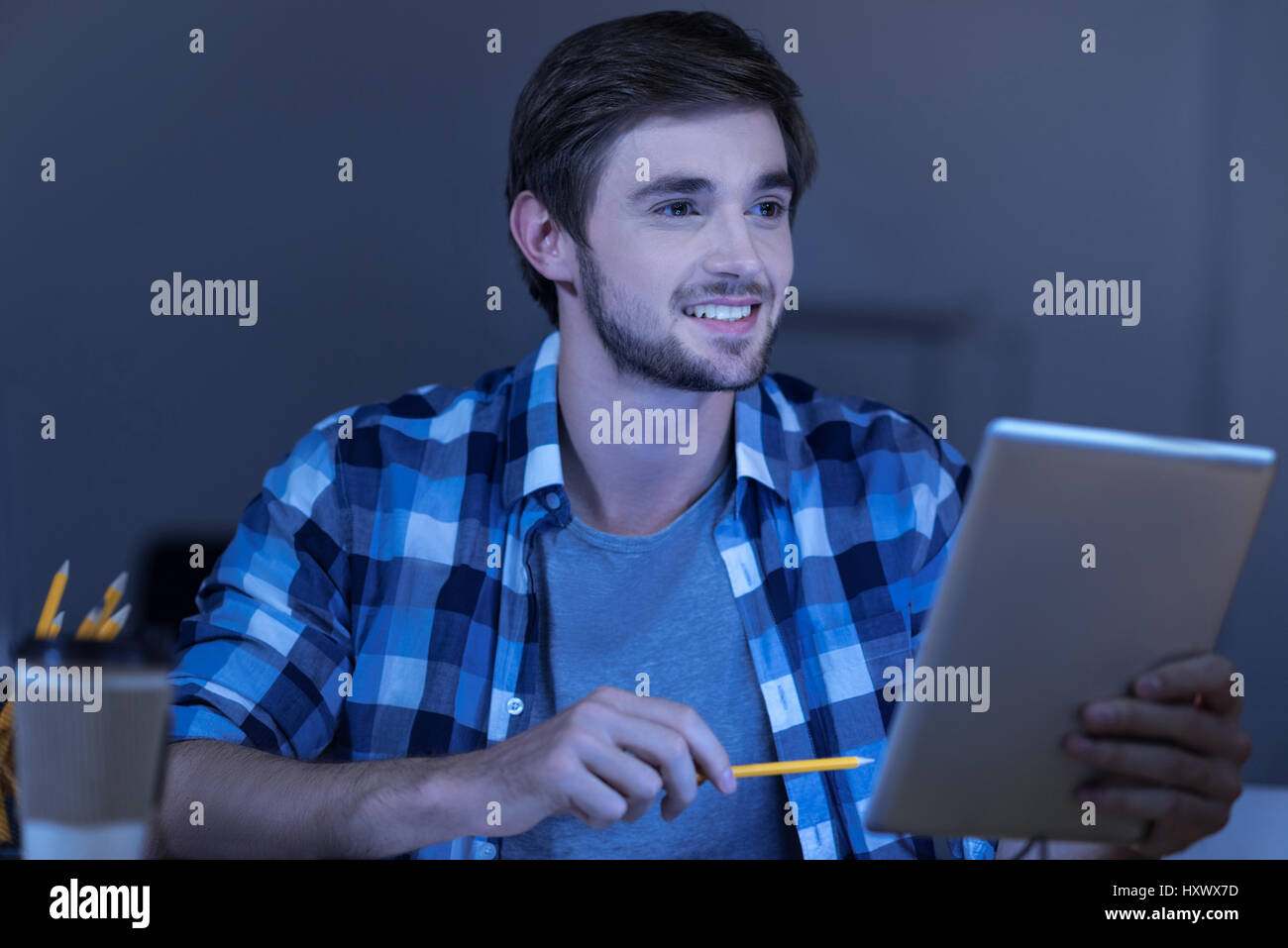 Cheerful nice man being happy about his work Stock Photo - Alamy