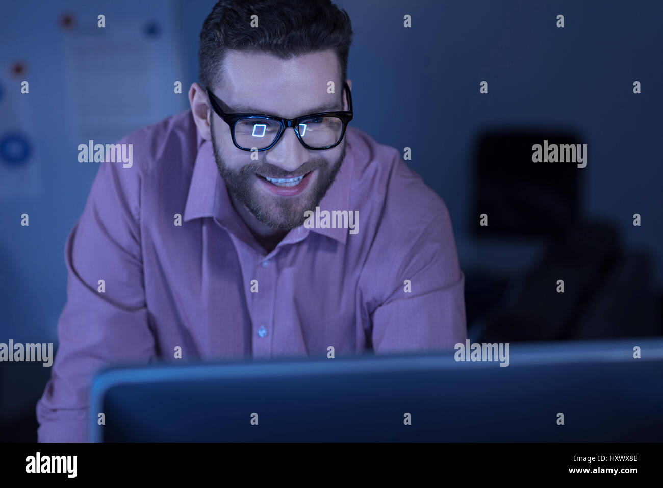 Positive happy man finishing his project Stock Photo - Alamy