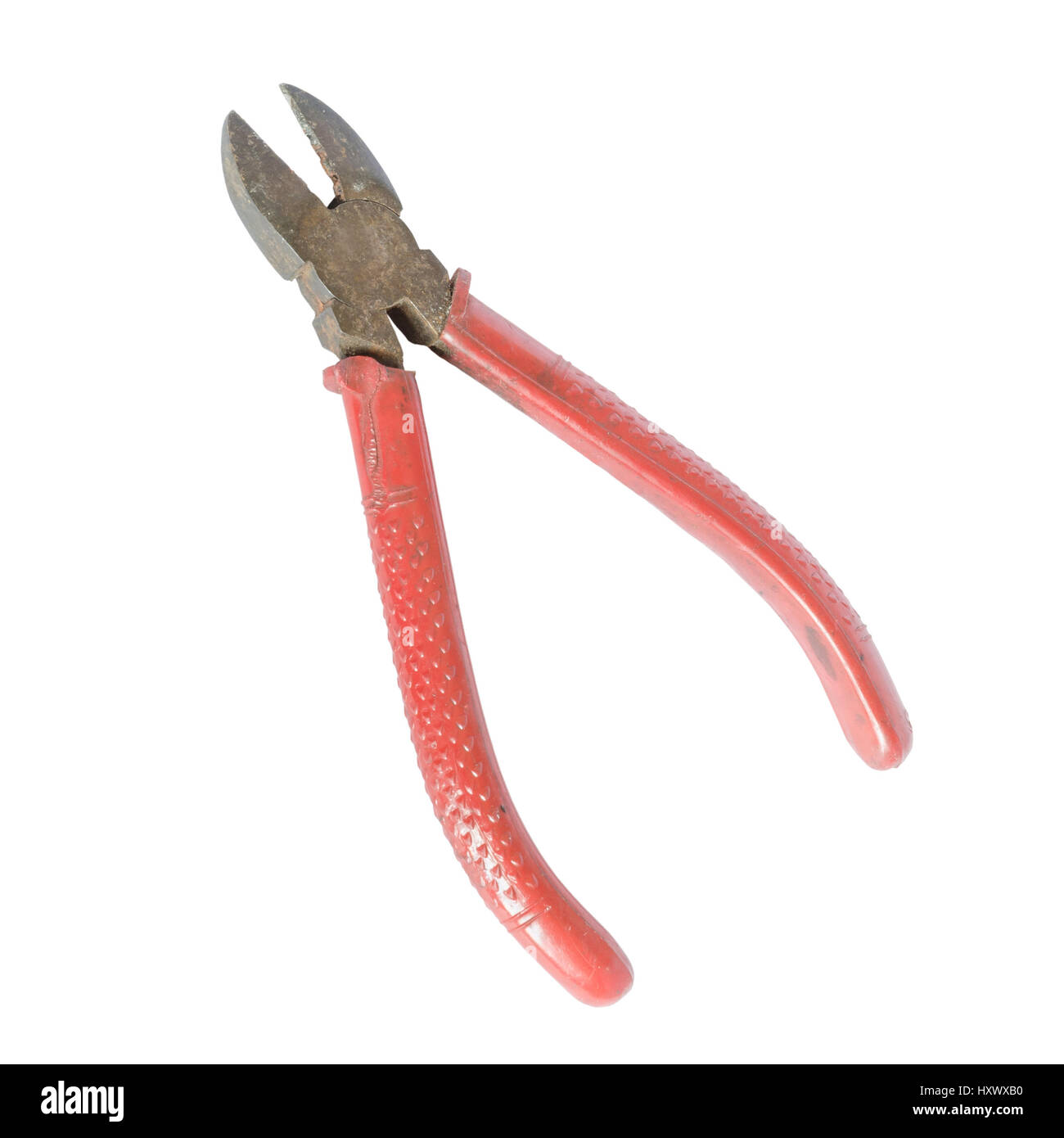 Old rust pliers with red rubber handle isolated on white background ...