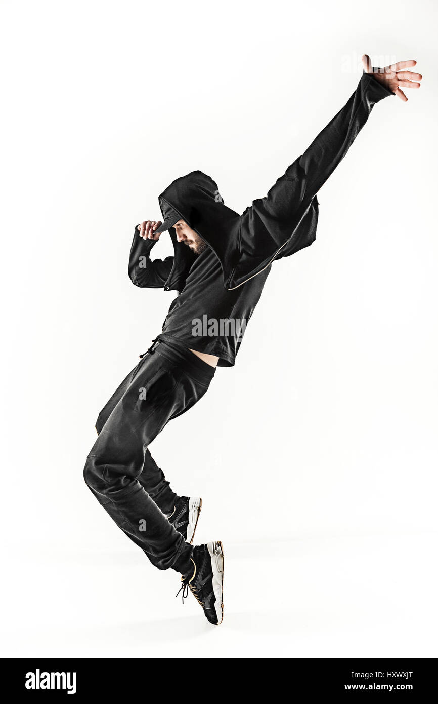 The silhouette of one hip hop male break dancer dancing on white ...