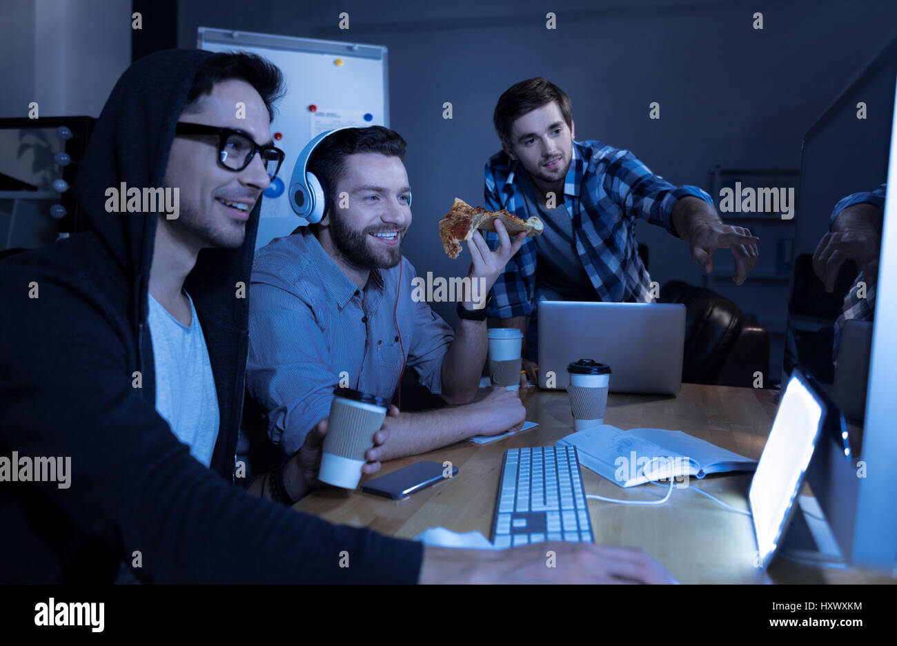 Positive handsome programmers having fun Stock Photo - Alamy