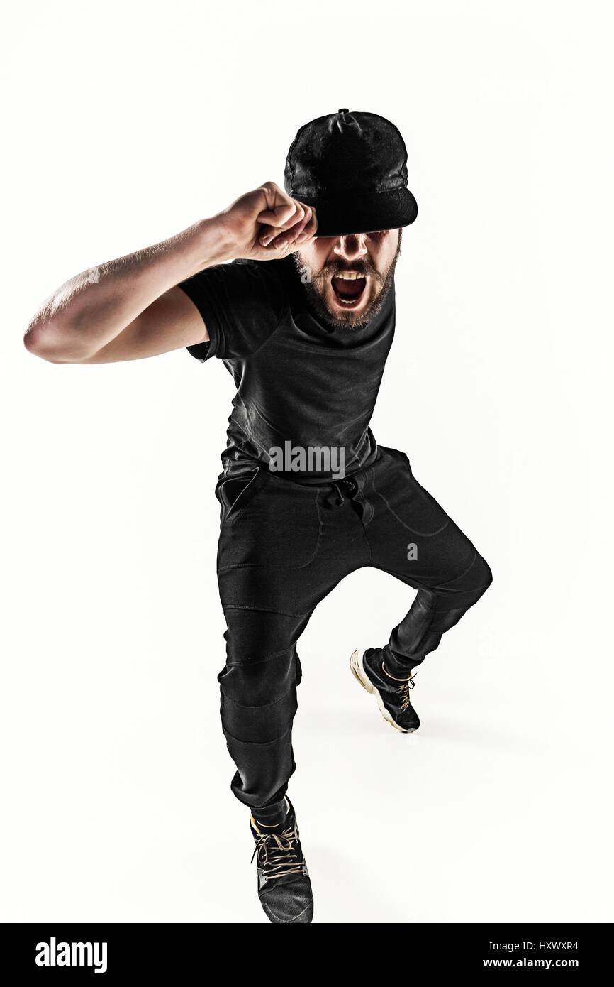 The silhouette of one hip hop male break dancer dancing on white ...