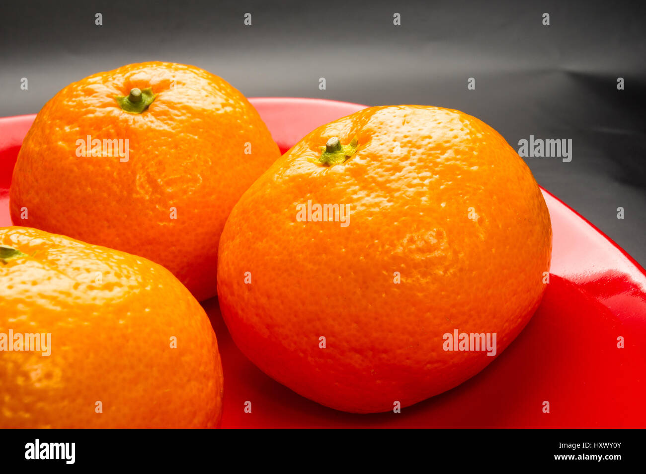 Tangerines cut in half hi-res stock photography and images - Alamy