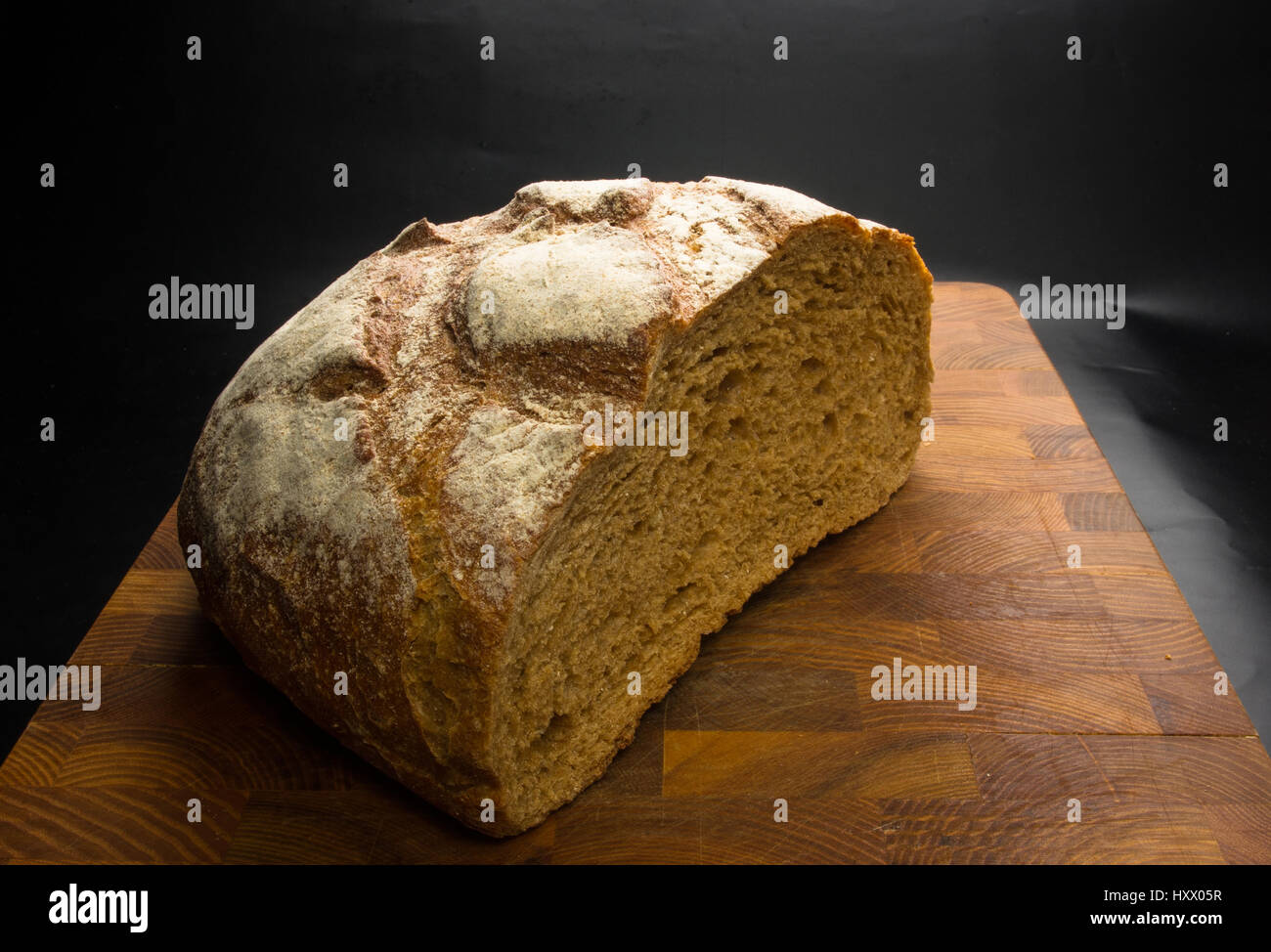 cut malt bread handmade on wooden background Stock Photo - Alamy