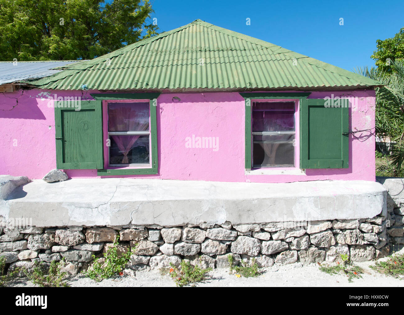 The characteristic pink color house in Cockburn Town on Grand Turk ...